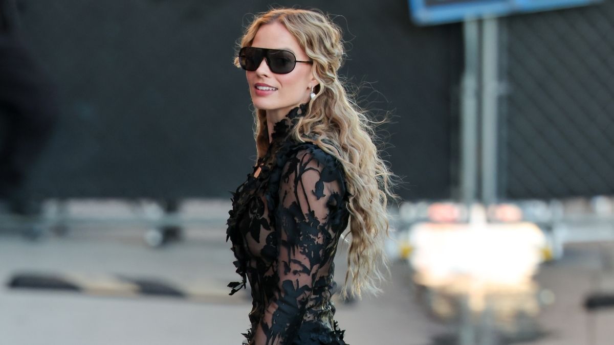 Margot Robbie Turns Heads in Feather Minidress During Press Tour ...