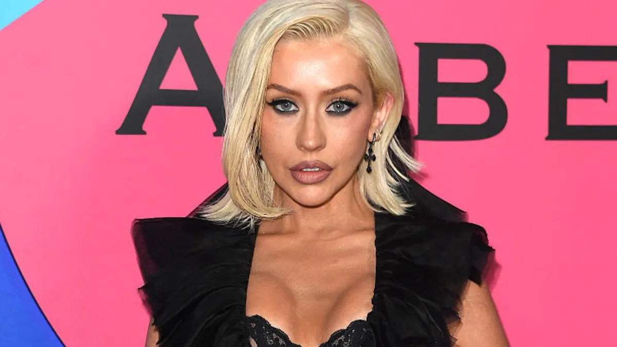 Christina Aguilera Lets Her Lingerie Peek from Deeply Plunging Top ...